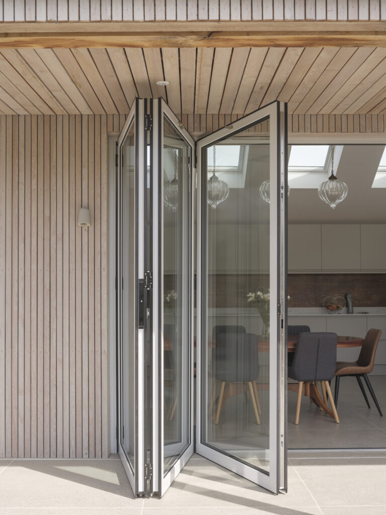 A light-filled coastal home transformed with Schüco bi-fold doors ...